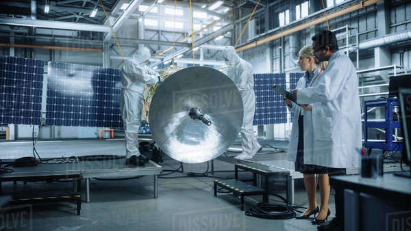 Team of Engineers Working on Satellite Construction, Use Tablet ...