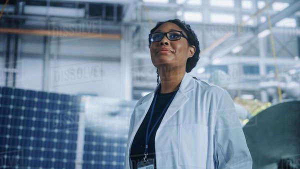 Brilliant Female Engineer Looking Around in Wonder at the Aerospace ...