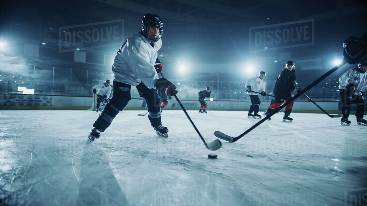 Ice Hockey Rink Arena: Professional Forward Player Masterfully Dribbles ...