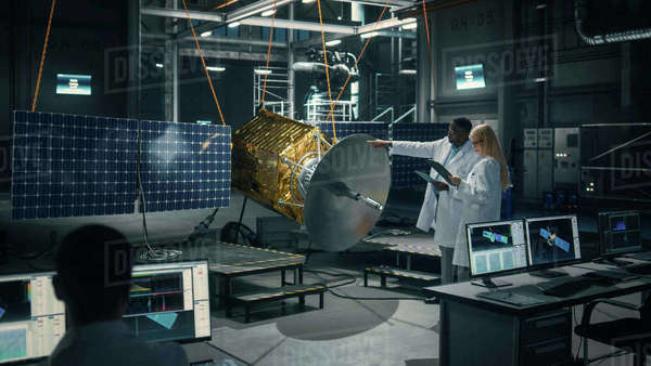 Team of Engineers Working on Satellite Construction. Aerospace Agency ...