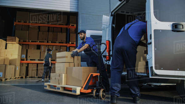 Diverse Team of Workers use Hand Truck Start Loading Delivery Truck ...