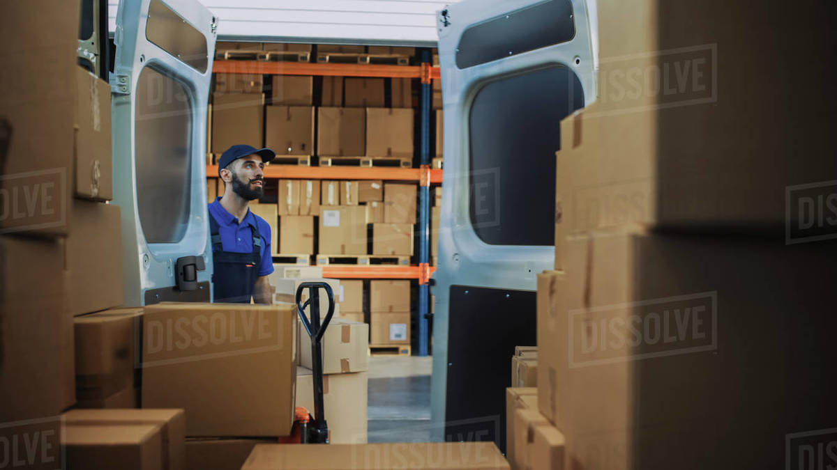 Worker Load Delivery Truck with Cardboard Boxes - Stock Photo - Dissolve