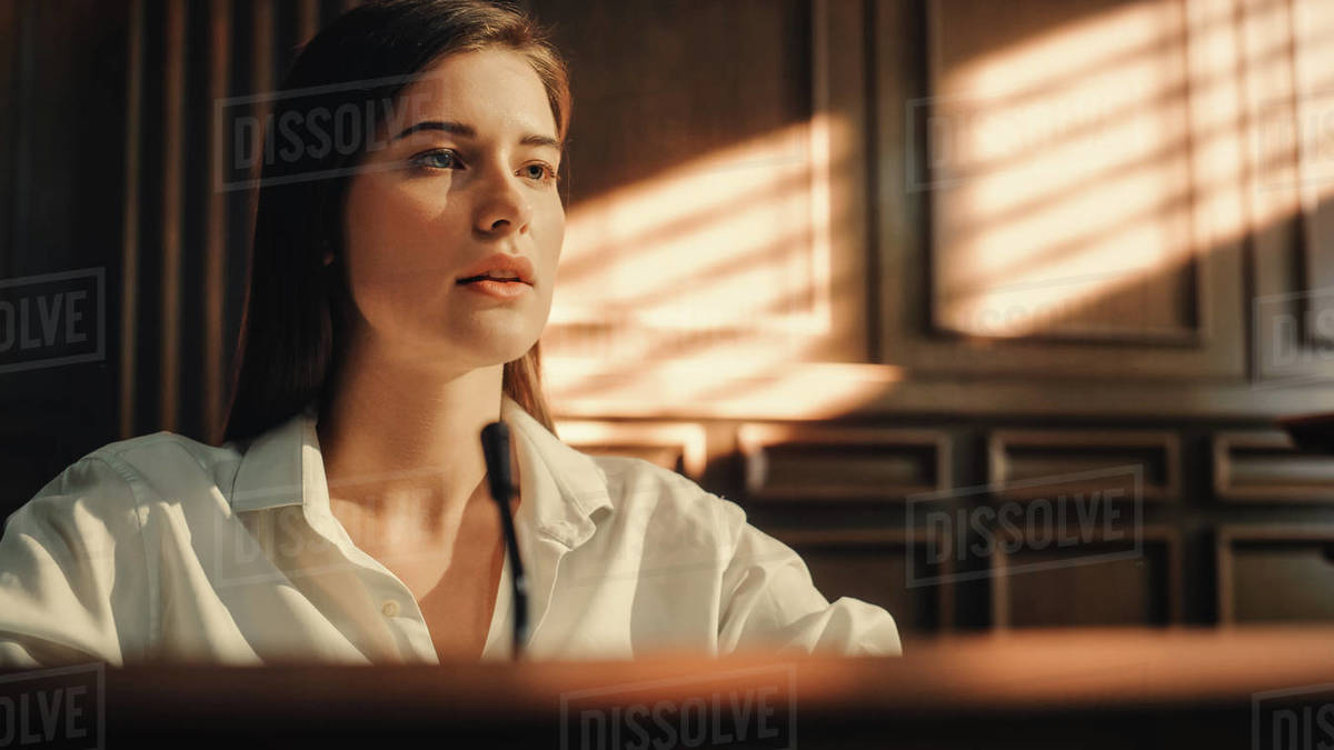 Female Witness Giving Evidence to Prosecutor and Defense Counsel ...