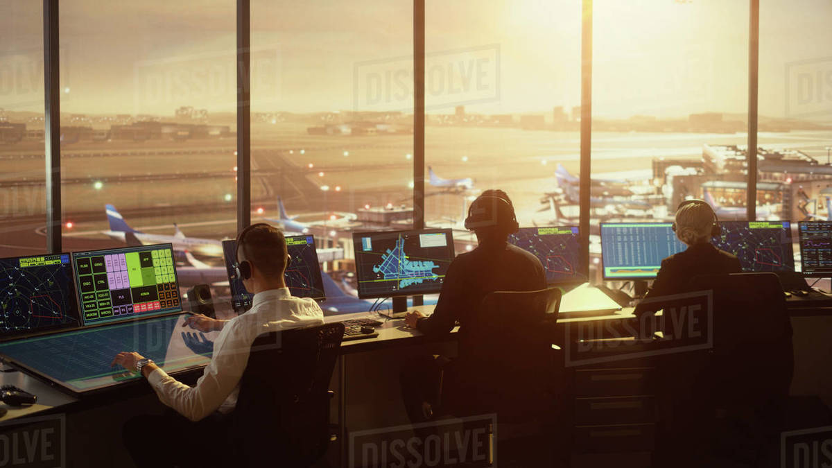 Diverse Air Traffic Control Team Working in a Modern Airport Tower at ...