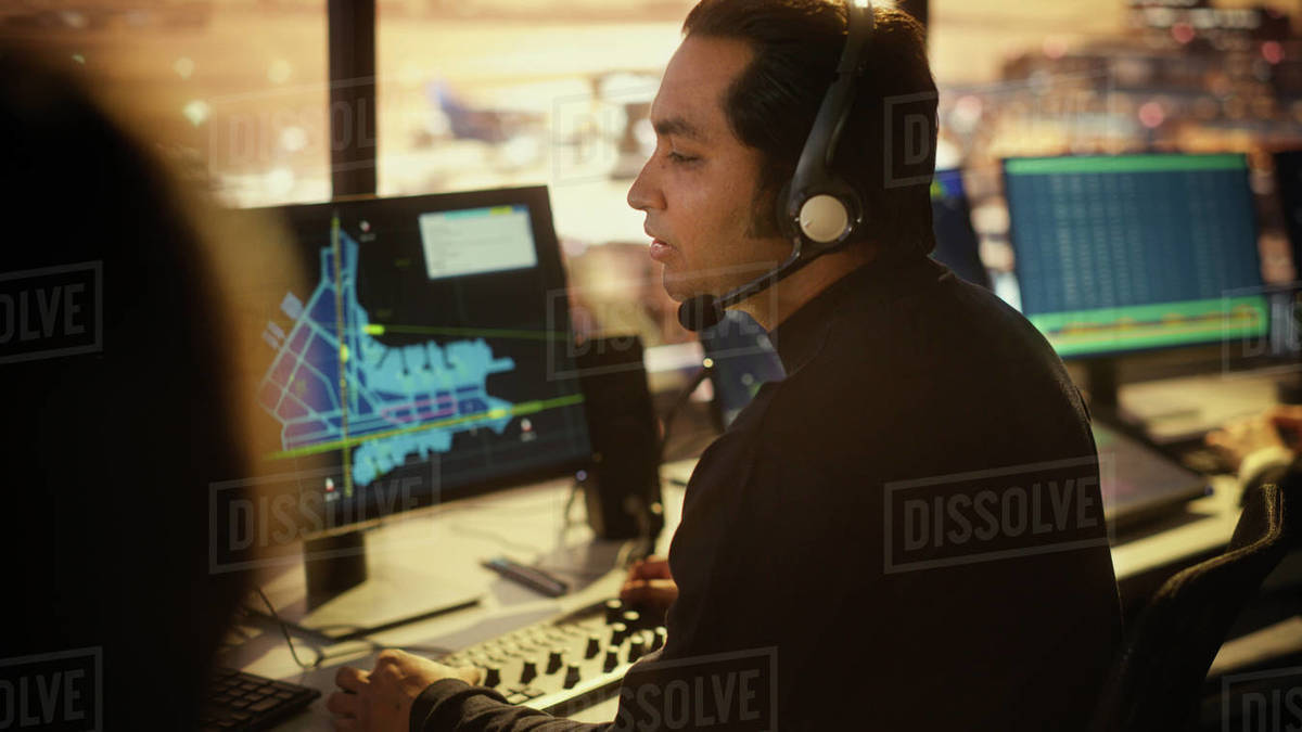 Portrait of Male Air Traffic Controller with Headset Talk on a Call in ...