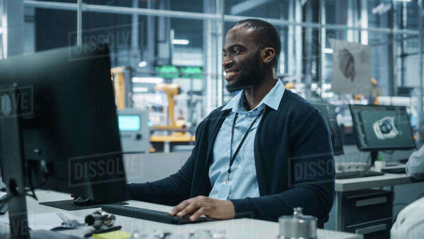 Portrait of Confident Black Male Chief Engineer Working on Desktop ...
