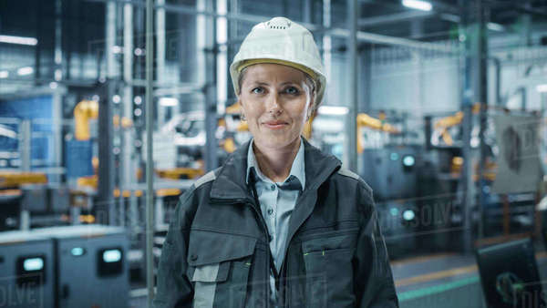Portrait of Female Chief Engineer Wearing Hard Hat Looking at Camera ...