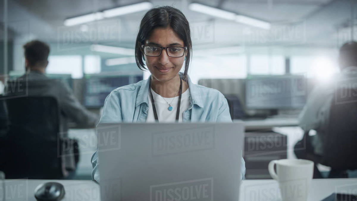 Diverse Office: Portrait of Smiling Indian IT Programmer Working on ...