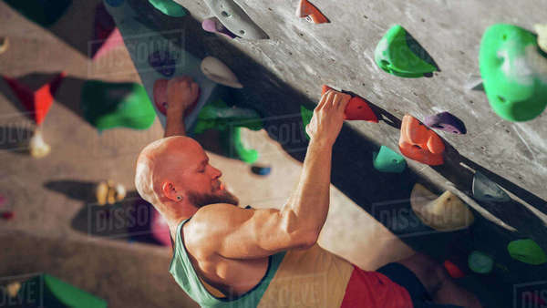 Strong Experienced Rock Climber Practicing Solo Climbing on Bouldering ...