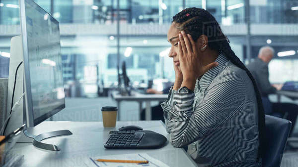 Female Corporate Office Worker Feels Stress - Stock Photo - Dissolve