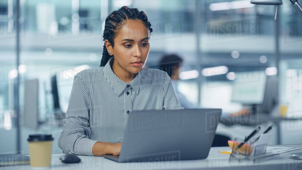 Professional Female IT Engineer Working on Desktop on Laptop Computer ...
