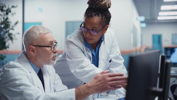 Female Chief Surgeon and Male General Physician Finding Cure - Stock ...