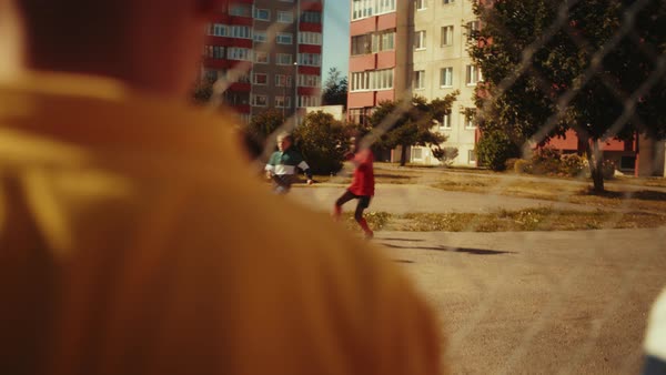 Neighborhood Friends Playing Soccer Outside in Urban Backyard ...