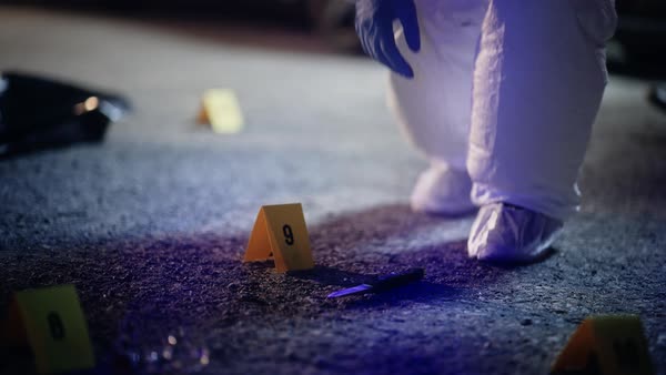 Forensics Specialist Picking a Bloody Knife From Crime Scene and ...