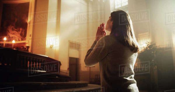 Side View: Christian Woman Getting on her Knees and Starting to Pray in ...