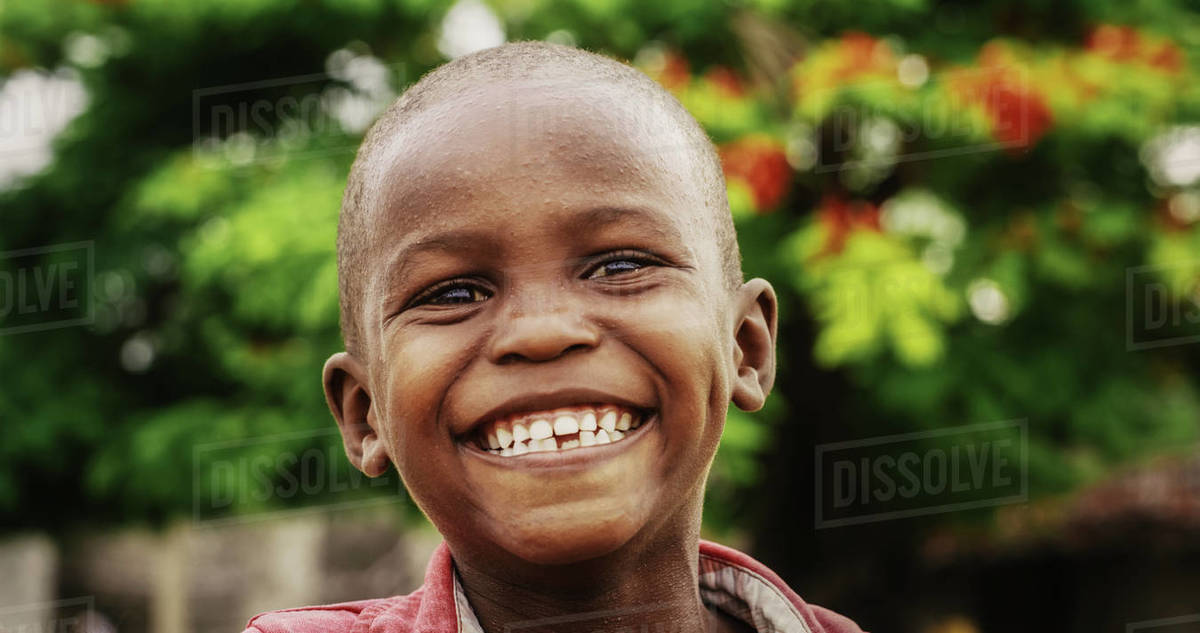 Close Up Portrait of an Expressive Authentic African Kid Laughing and ...