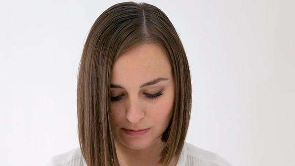 Serious woman looking down looks up at camera - Stock Video Footage ...