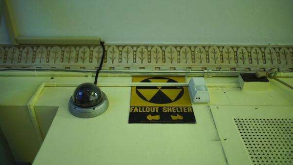 Radiation hazard sign and surveillance camera inside building - HD ...