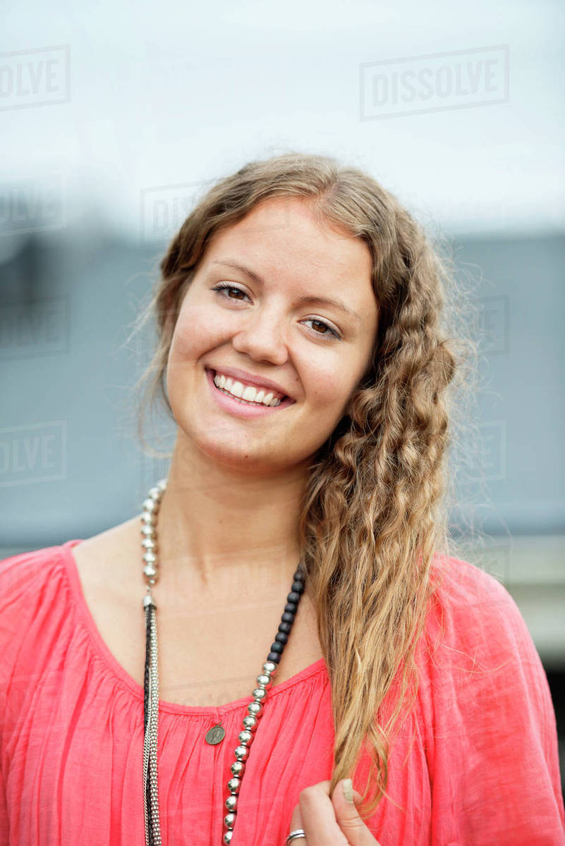 Portrait of smiling woman - Stock Photo - Dissolve