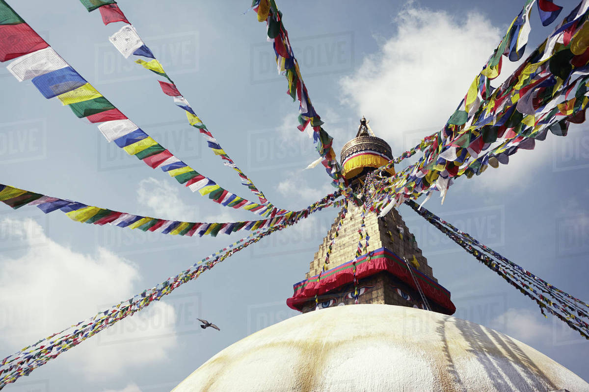 Stupa with prayer flags - Royalty-free Stock Photo | Dissolve