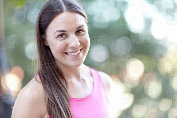 Portrait of smiling woman - Royalty-free Stock Photo | Dissolve