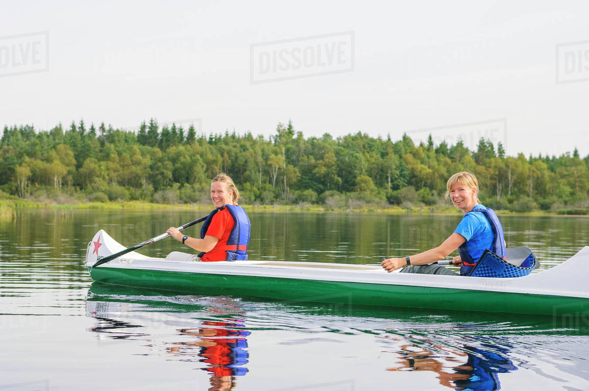 Women kayaking - Stock Photo - Dissolve