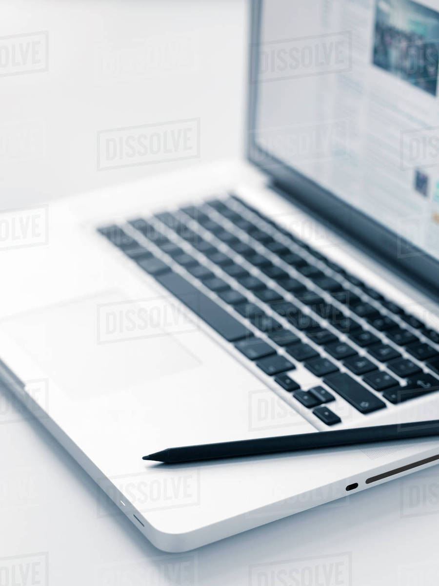 Pencil on laptop - Royalty-free Stock Photo | Dissolve