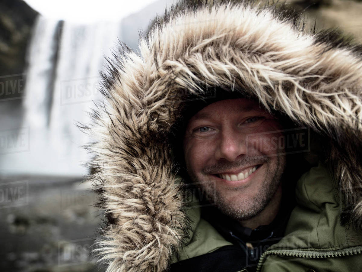 Smiling man wearing hood - Royalty-free Stock Photo | Dissolve
