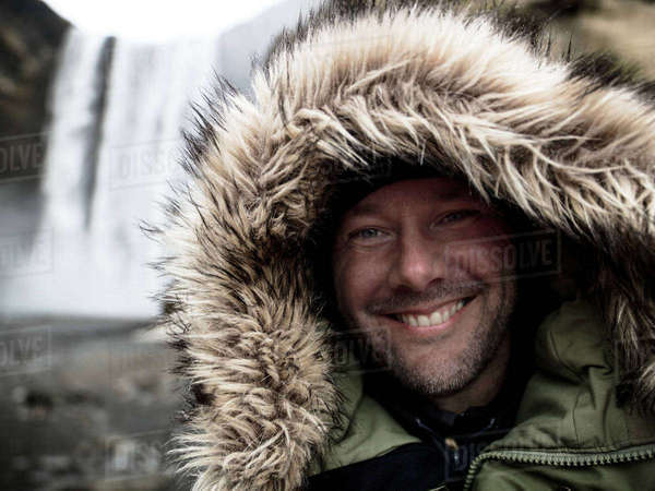 Smiling man wearing hood - Royalty-free Stock Photo | Dissolve