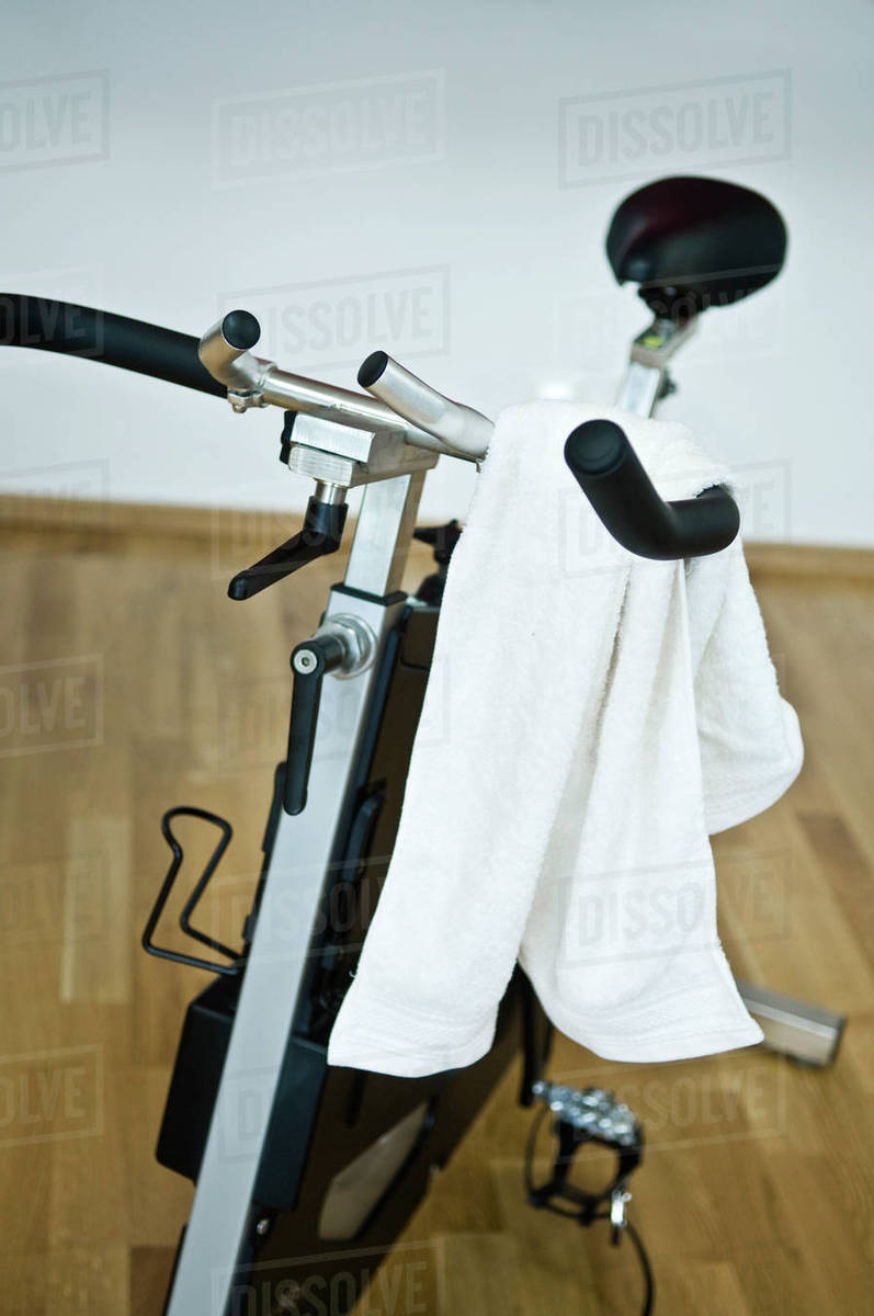Towel on indoor bicycle - Royalty-free Stock Photo | Dissolve