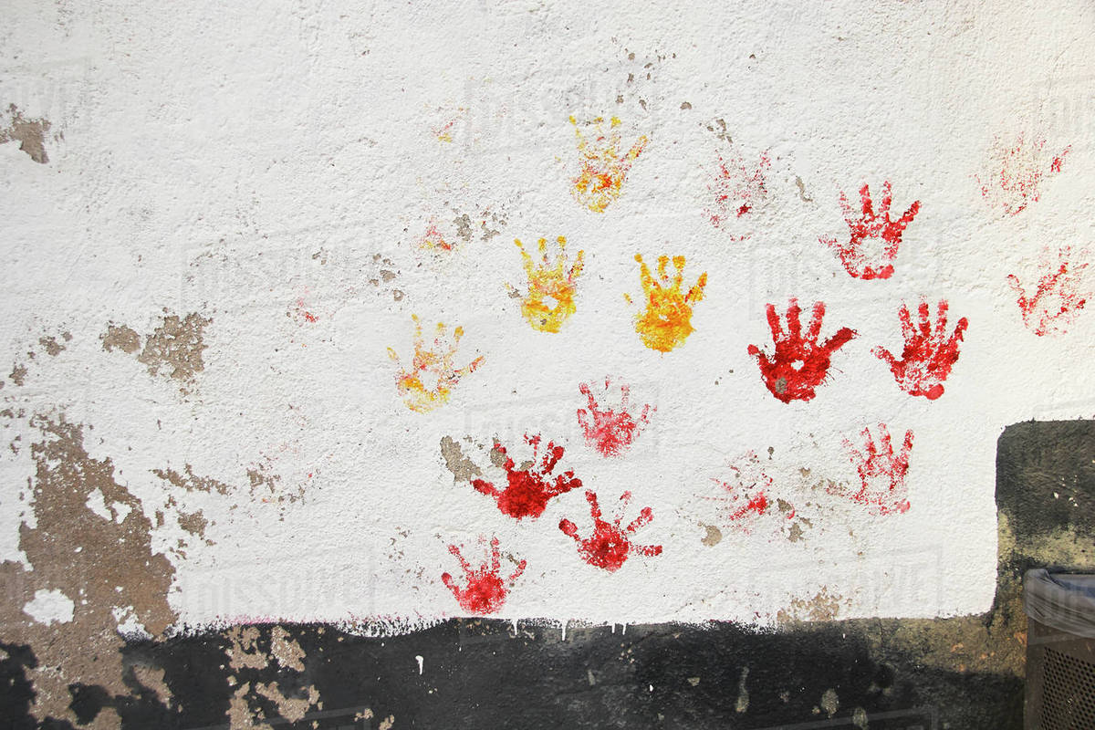 Handprints on wall - Stock Photo - Dissolve