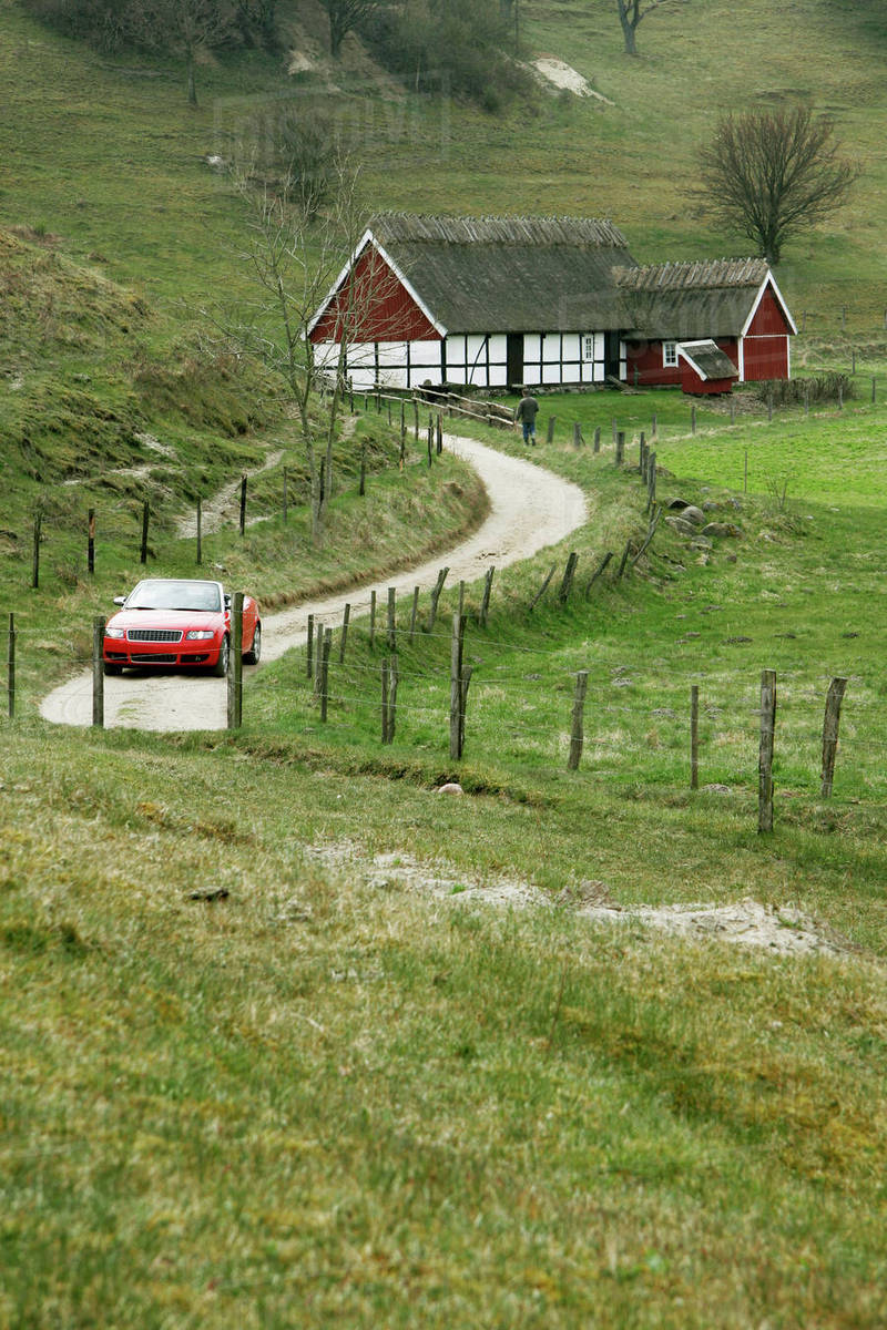 Car on country road - Stock Photo - Dissolve