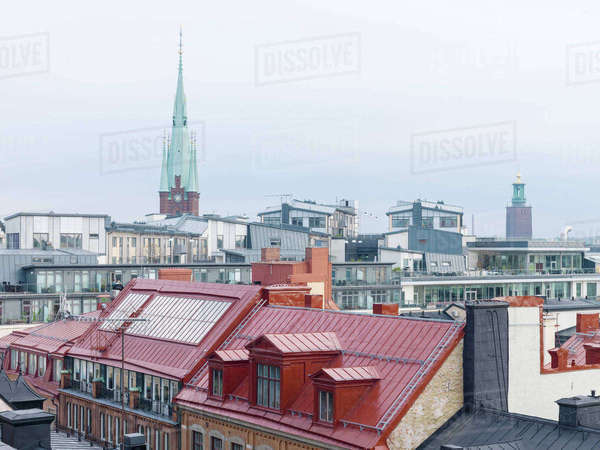 Buildings roofs, tower on background - Stock Photo - Dissolve