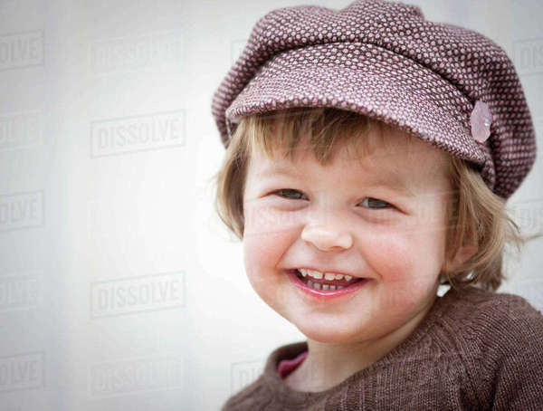Smiling girl wearing cap - Royalty-free Stock Photo | Dissolve