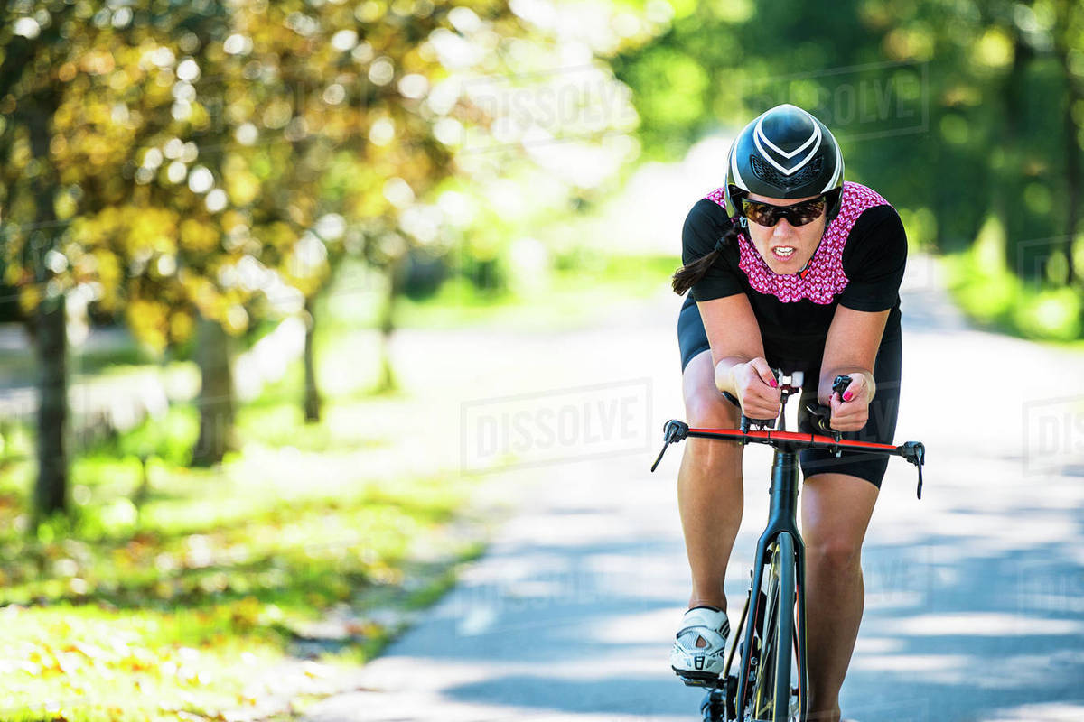 Woman cycling - Stock Photo - Dissolve