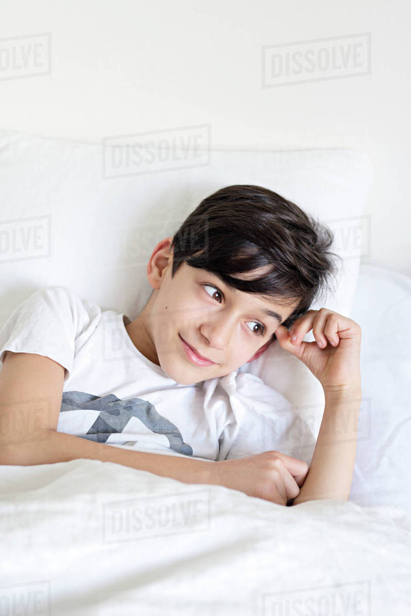 Boy in bed - Royalty-free Stock Photo | Dissolve