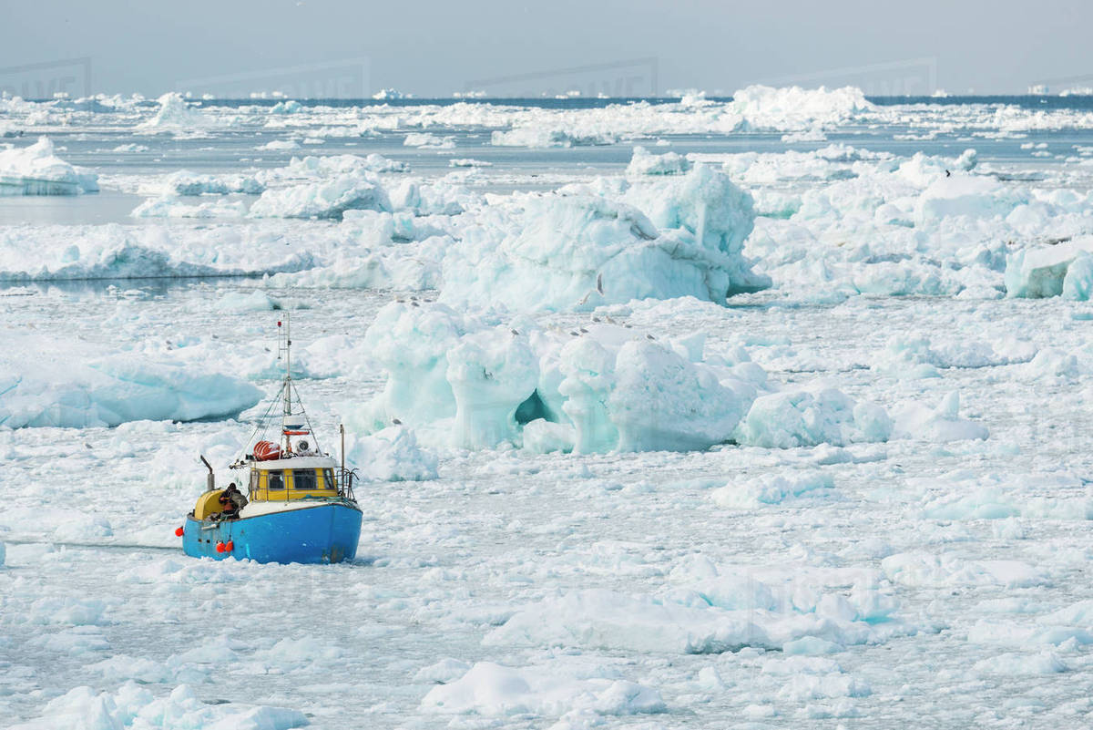 Boat in frozen sea - Royalty-free Stock Photo | Dissolve