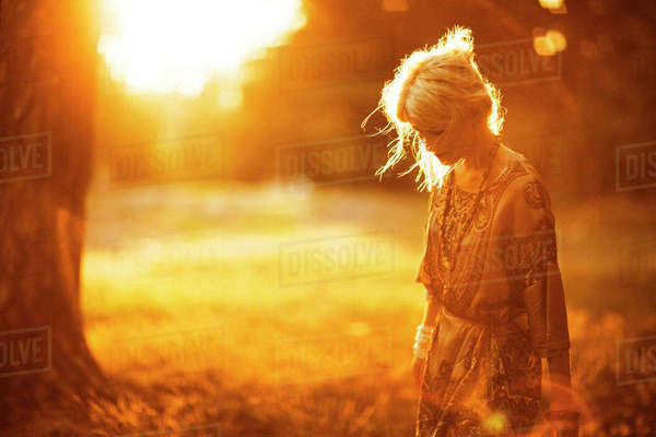 Beautiful woman at sunset - Stock Photo - Dissolve