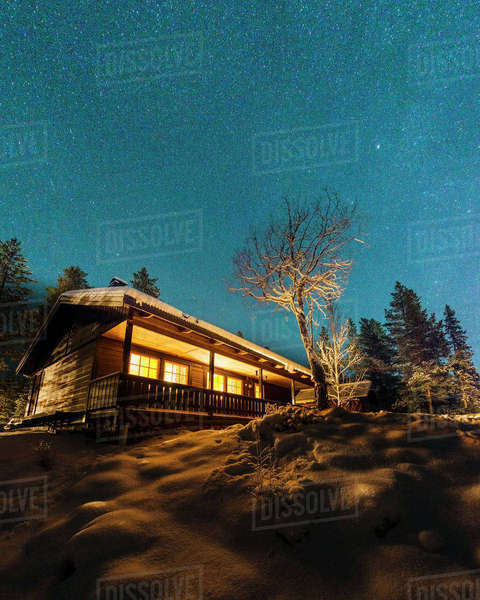Illuminated house at night - Stock Photo - Dissolve