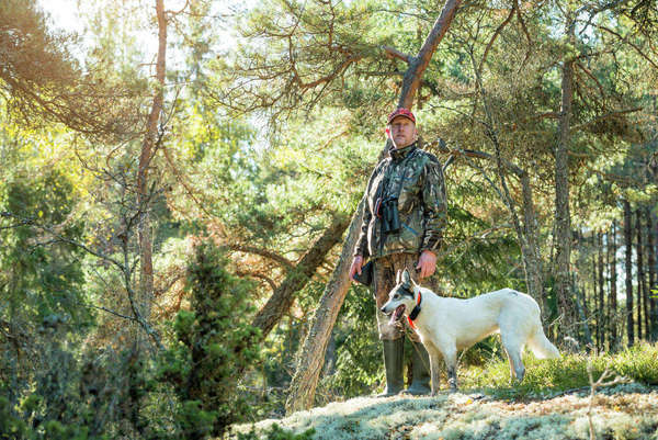 Man hunting with dog - Royalty-free Stock Photo | Dissolve