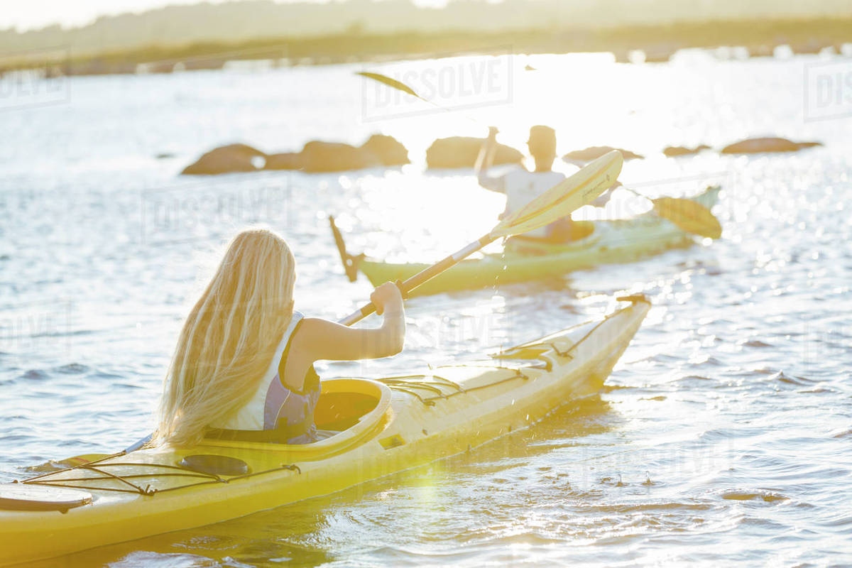 Women kayaking at evening - Stock Photo - Dissolve