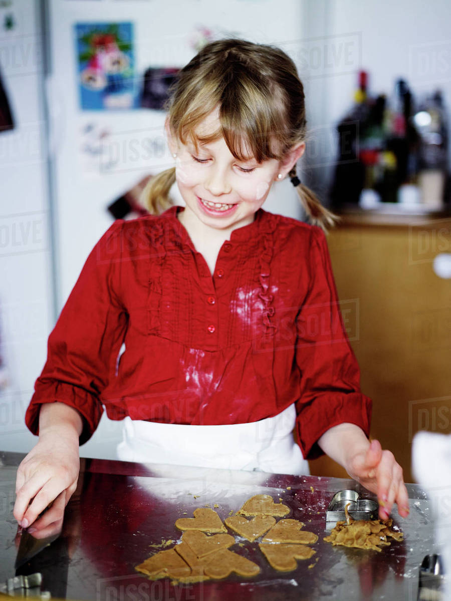 Girl making cookies - Royalty-free Stock Photo | Dissolve