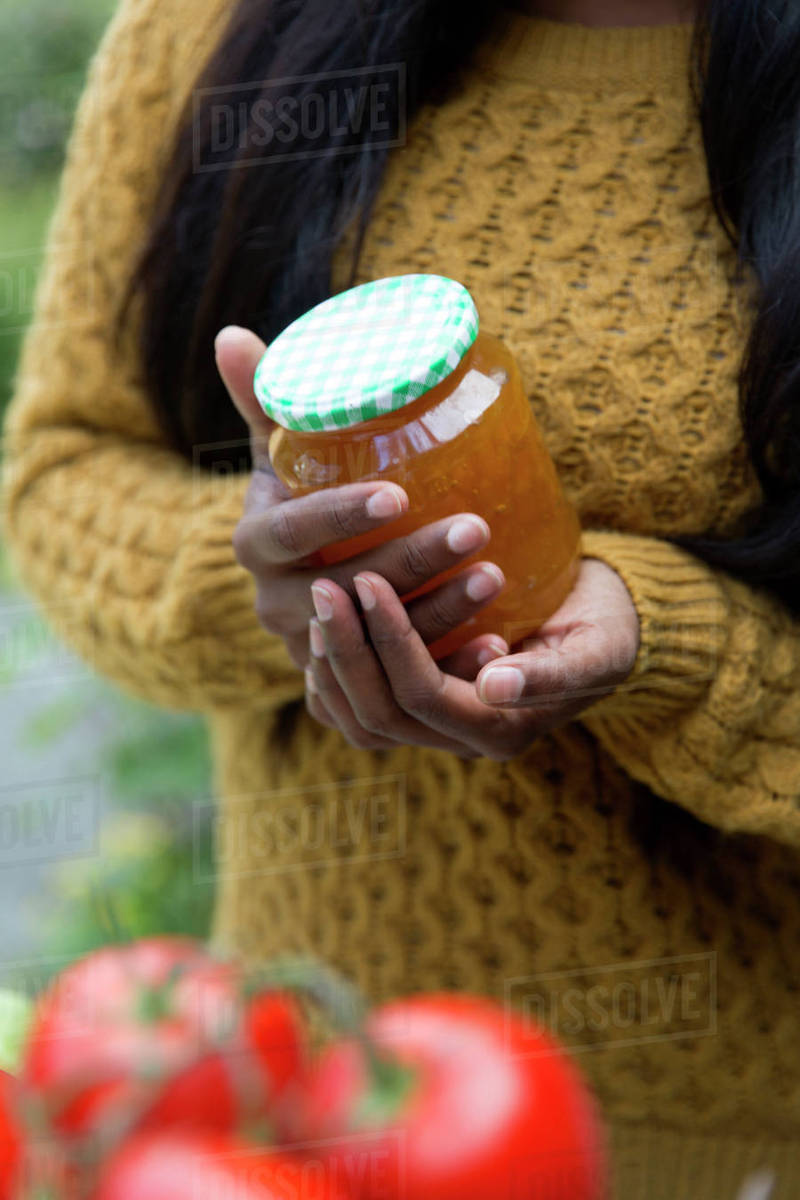 Woman holding jar - Royalty-free Stock Photo | Dissolve