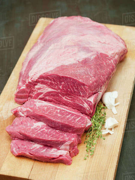 Meat on chopping board - Stock Photo - Dissolve