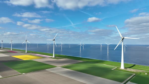 Wind turbines on a levee and offshore in Flevoland, The Netherlands ...