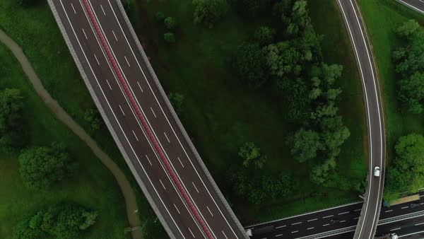 View from above countryside modern roadway junction with busy traffic ...