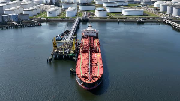 Crude Oil Liquid Cargo Transporter Ship Unloading Petrochemicals to a ...