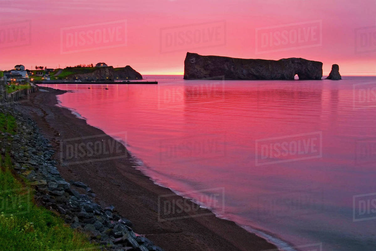 Red sunrise at Perce Rock, Quebec - Royalty-free Stock Photo | Dissolve