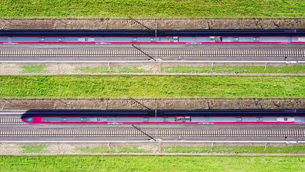Train aerial view overhead top view hovering while two trains passing ...