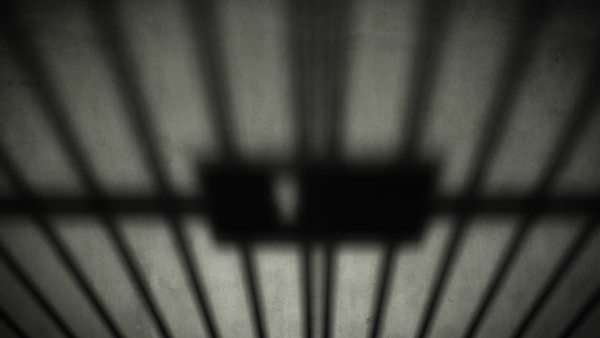 Prison cell door closing shadow on dark concrete jail floor - Stock ...